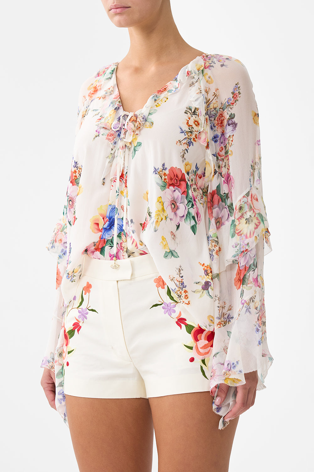 The I Left My Heart In Granada Lace Up V Neck Blouse With Cascade ...